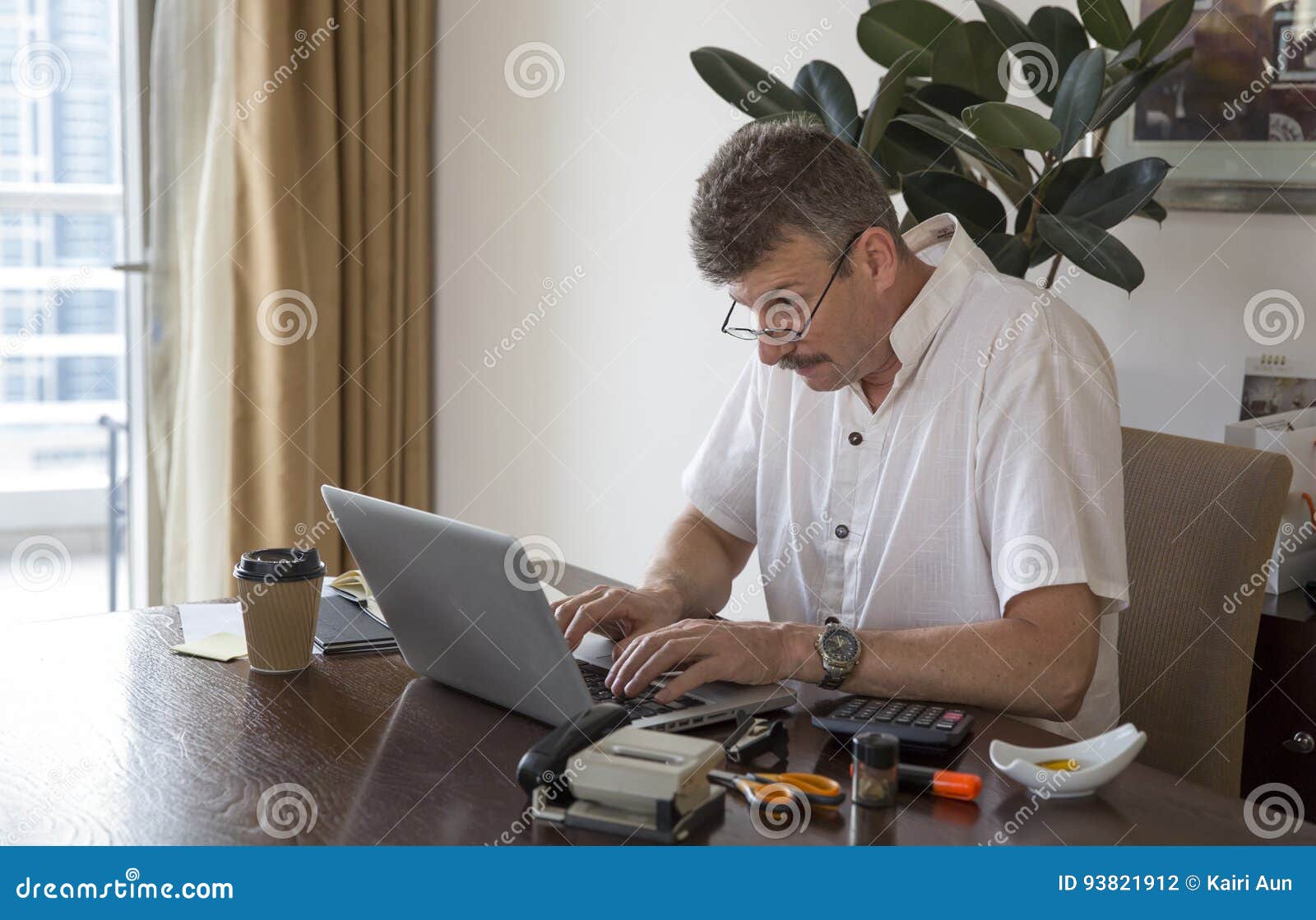 Middle Aged Man Working at this Computer at His Home Office Stock Photo ...