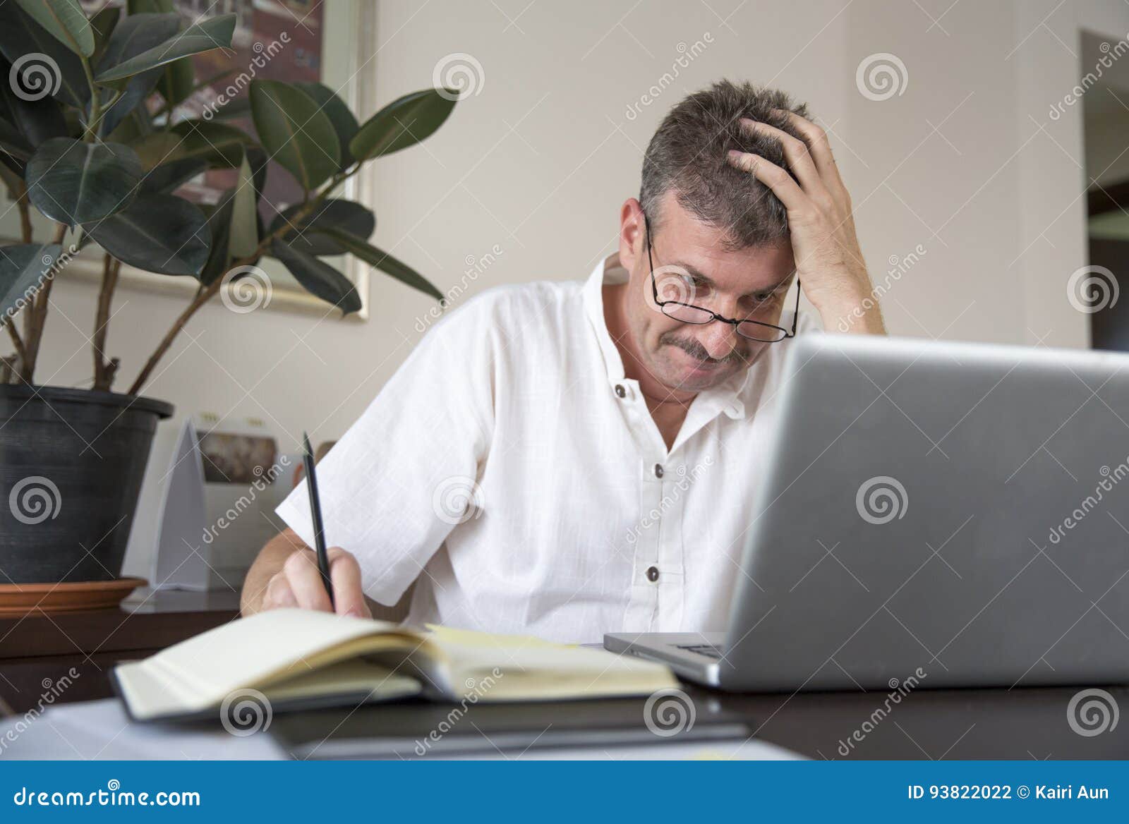 Middle Aged Man Working at this Computer at His Home Office Stock Photo ...