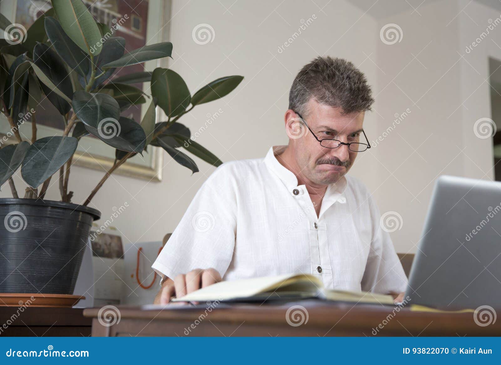 Middle Aged Man Working at this Computer at His Home Office Stock Photo ...
