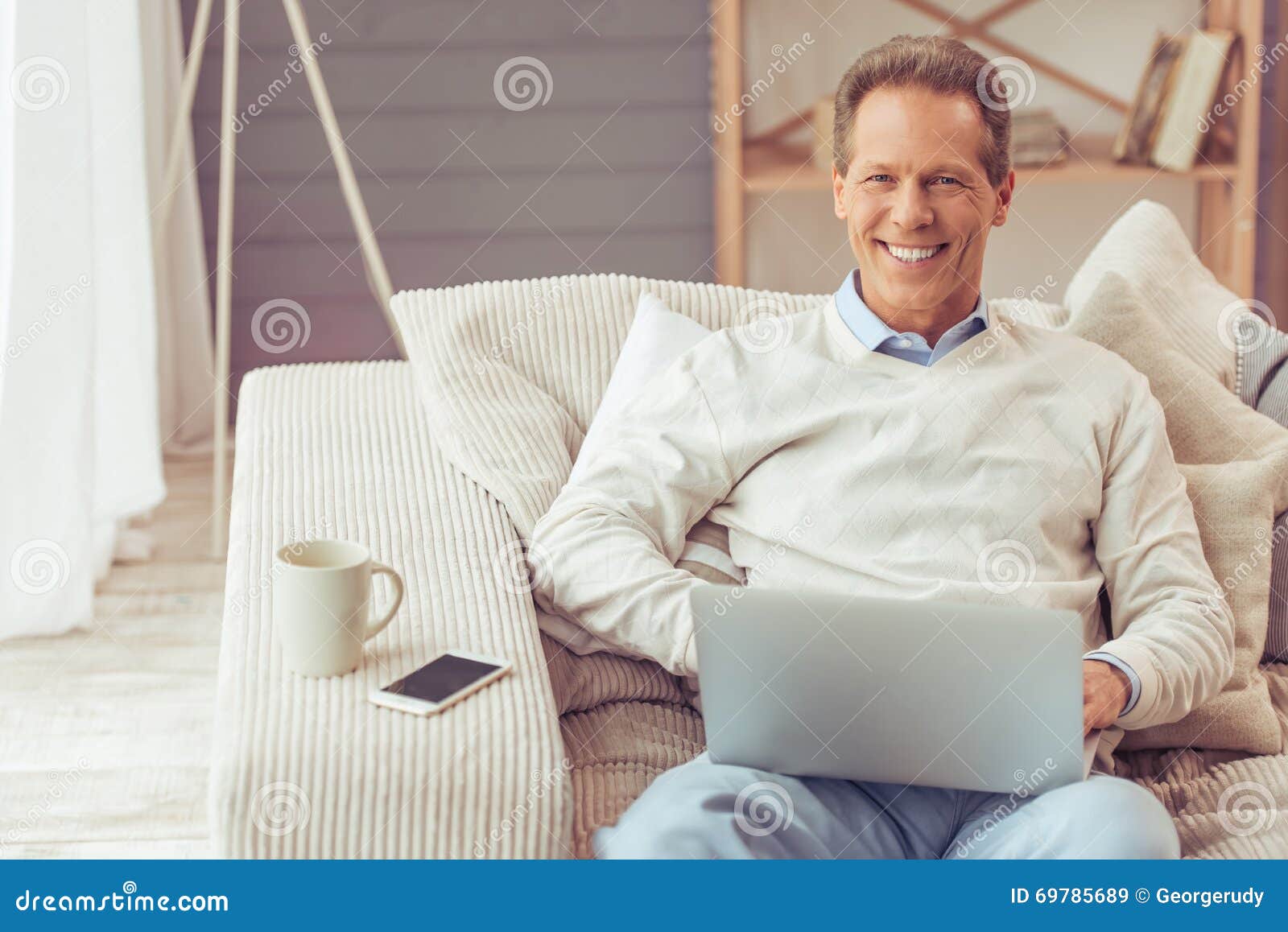 Middle aged man working stock image. Image of couch, employee - 69785689