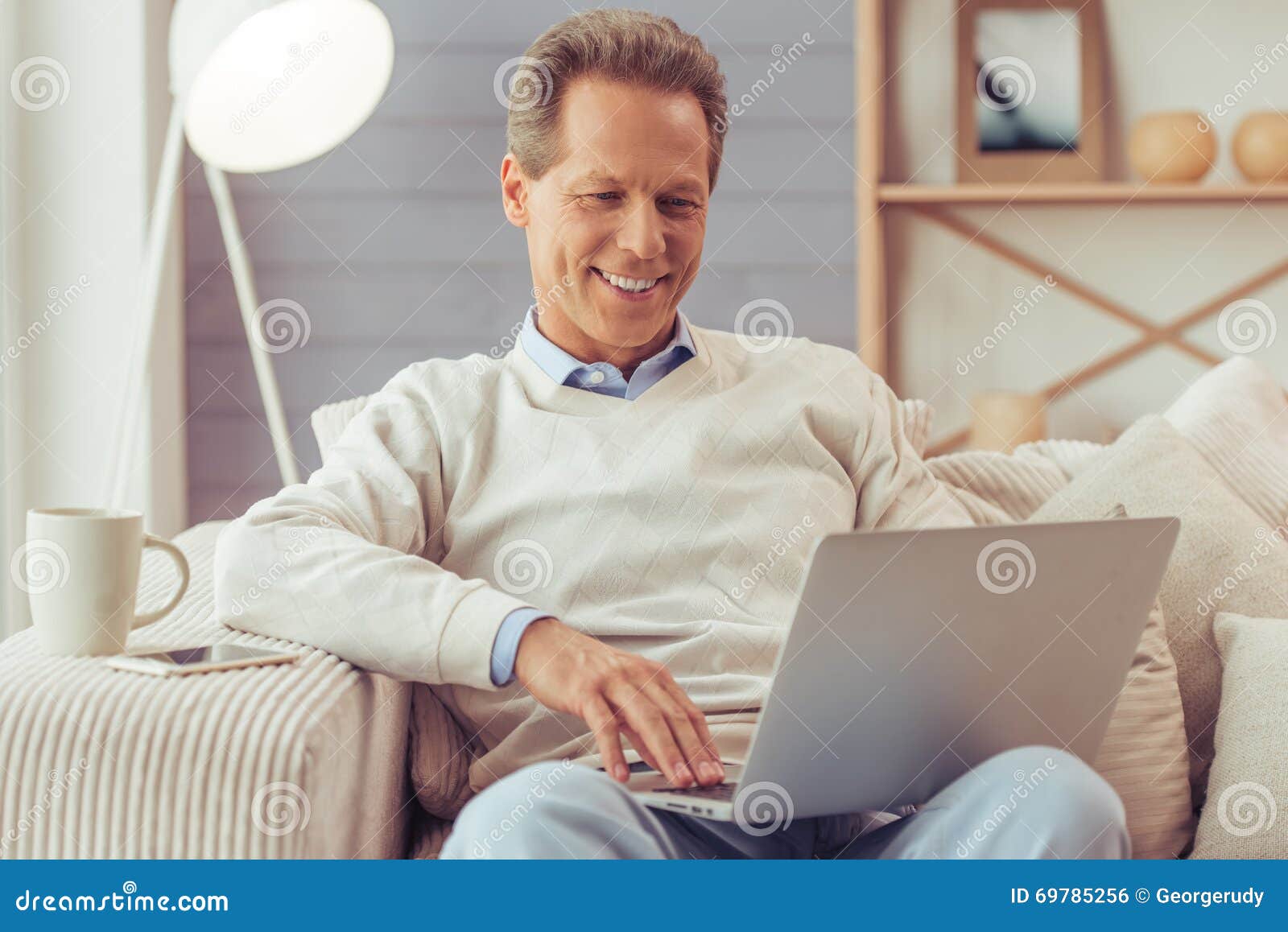 Middle aged man working stock photo. Image of laptop - 69785256