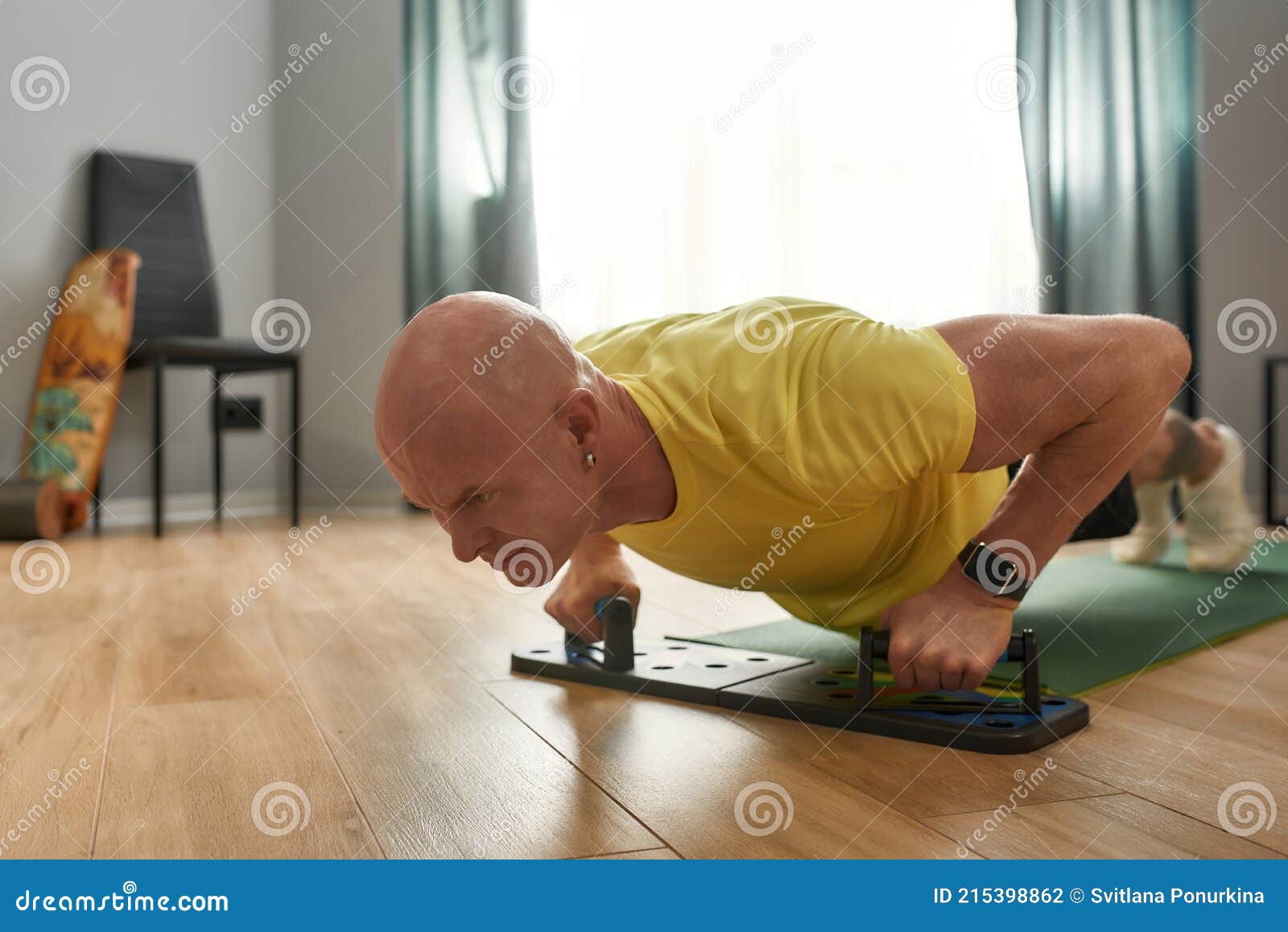Middle Aged Man Working Out on Push Up Training System Stock Photo ...