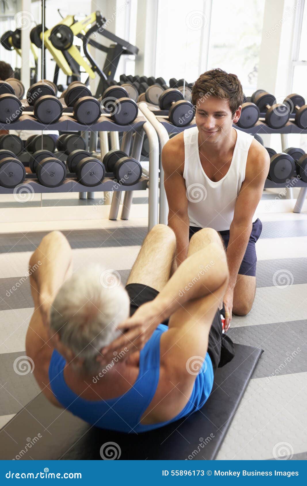 Middle Aged Man Working with Personal Trainer in Gym Stock Image ...