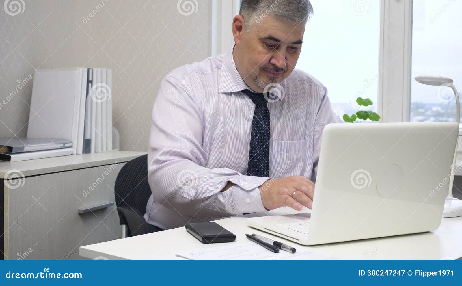 Middle Aged Man Working at a Computer in the Office Stock Video - Video ...