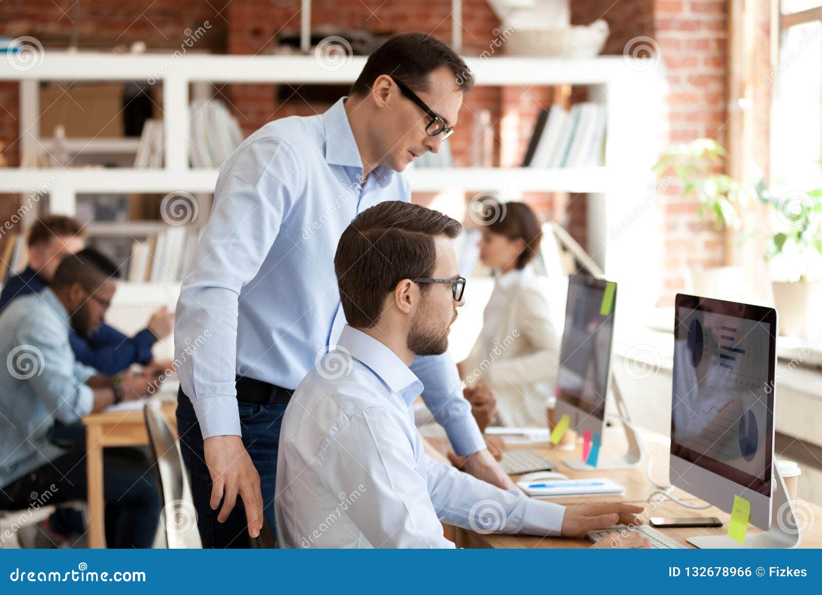 Middle Aged Mentor Helping Employee with Computer Work Stock Photo ...