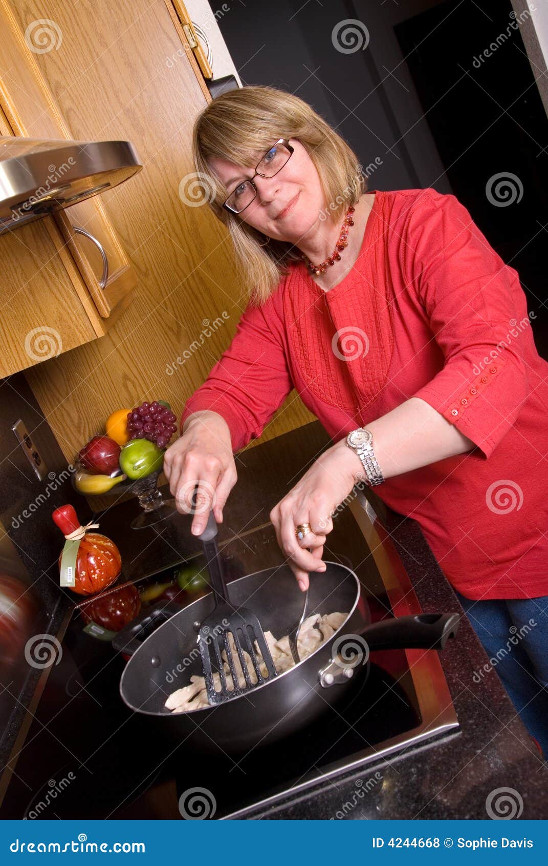 Middle aged woman cooking. stock photo. Image of fajitas - 4244668