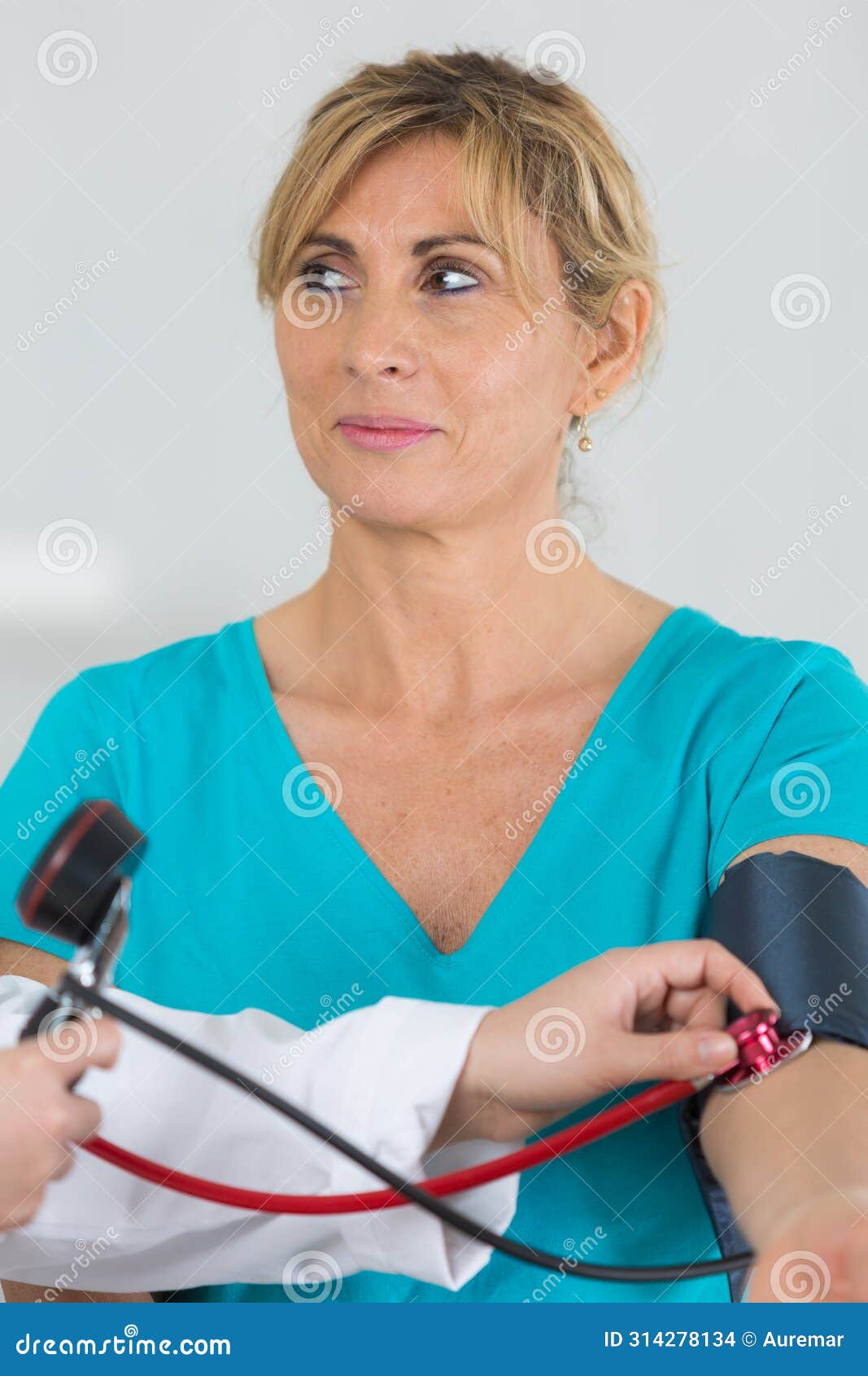 Middle Aged Woman Having Blood Pressure Test Stock Photo - Image of ...
