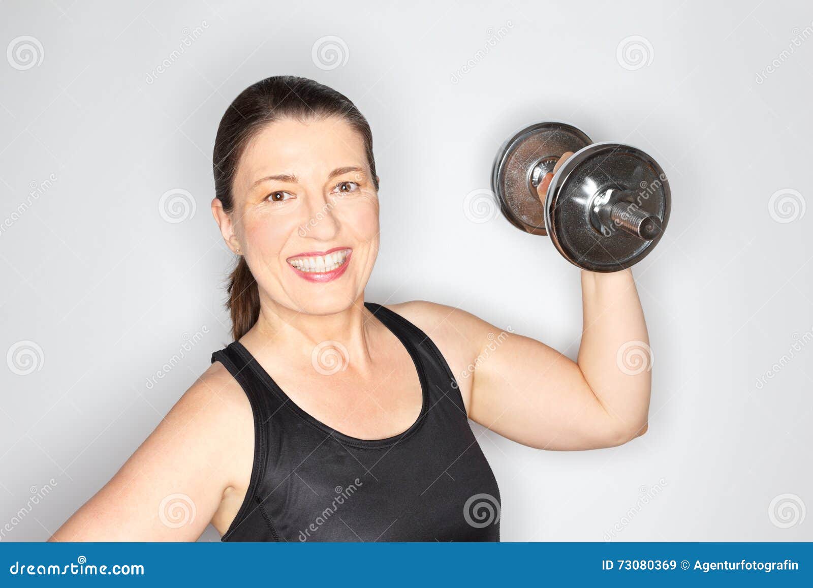 Middle Aged Woman Lifting Dumbbell Stock Image Image Of Confidence