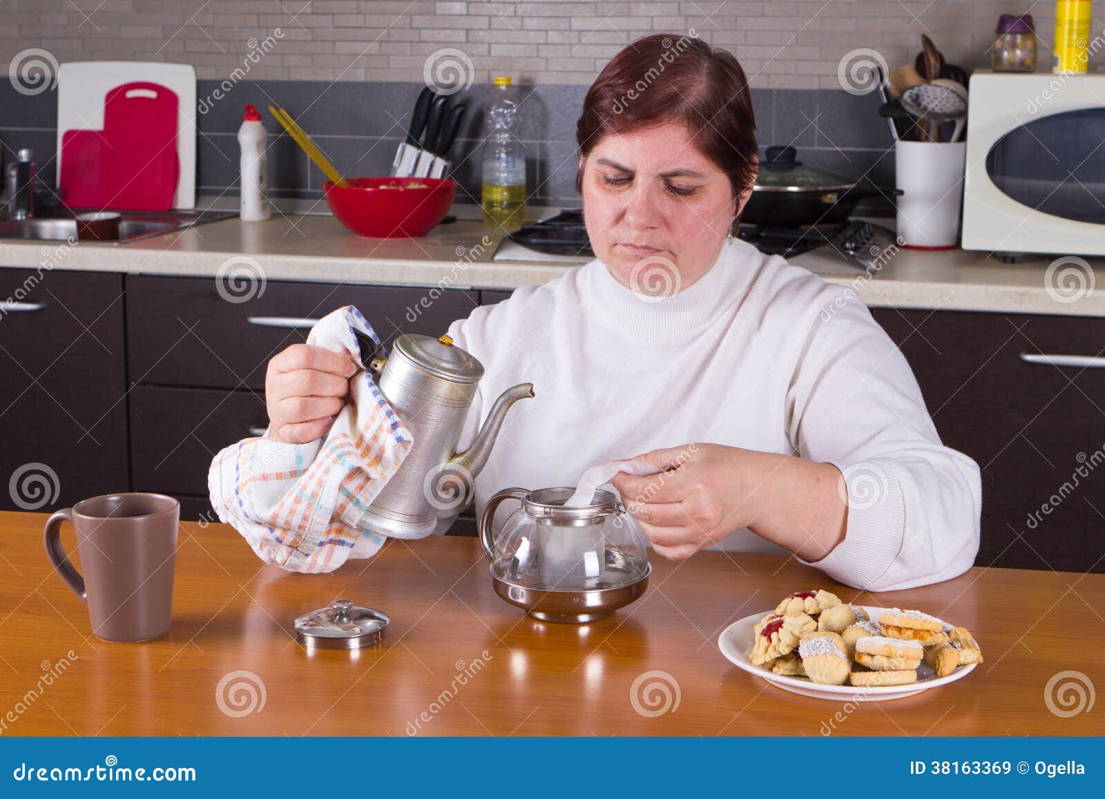 Middle-aged Woman Making Tea in Kitchen Stock Image - Image of tasty ...