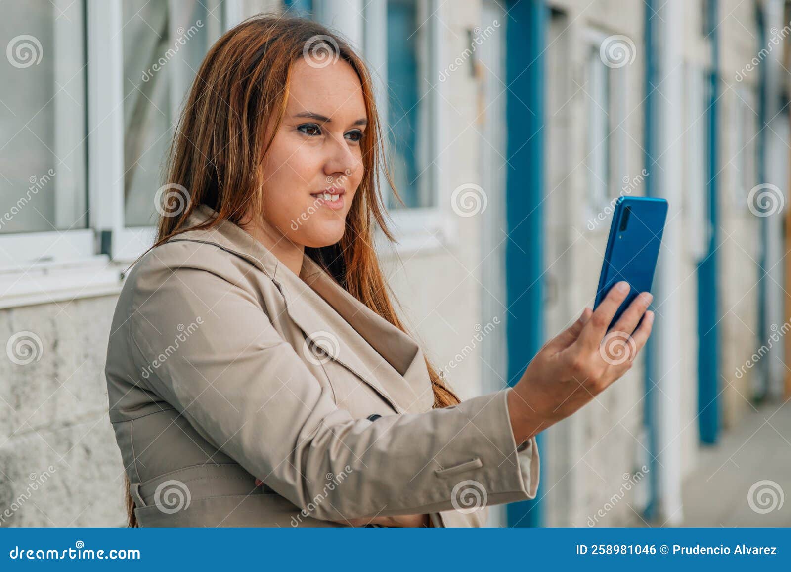 Woman with mobile phone stock photo. Image of outside - 258981046