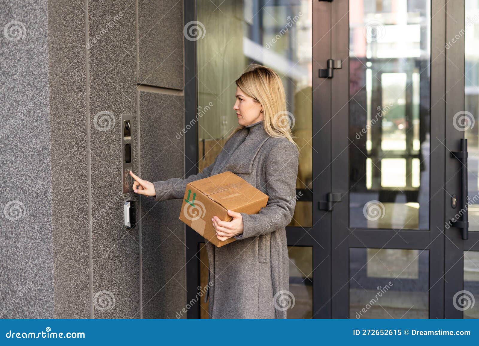 Middle Aged Woman Pushing Button of Intercom Stock Image - Image of ...