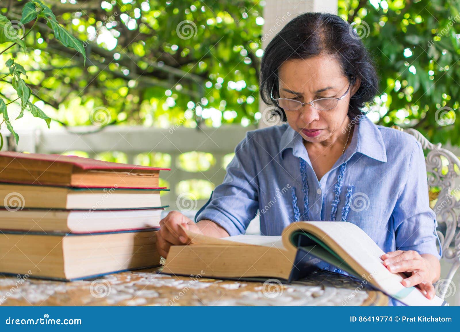Middle-aged Woman Reading a Book at Home Stock Photo - Image of park ...