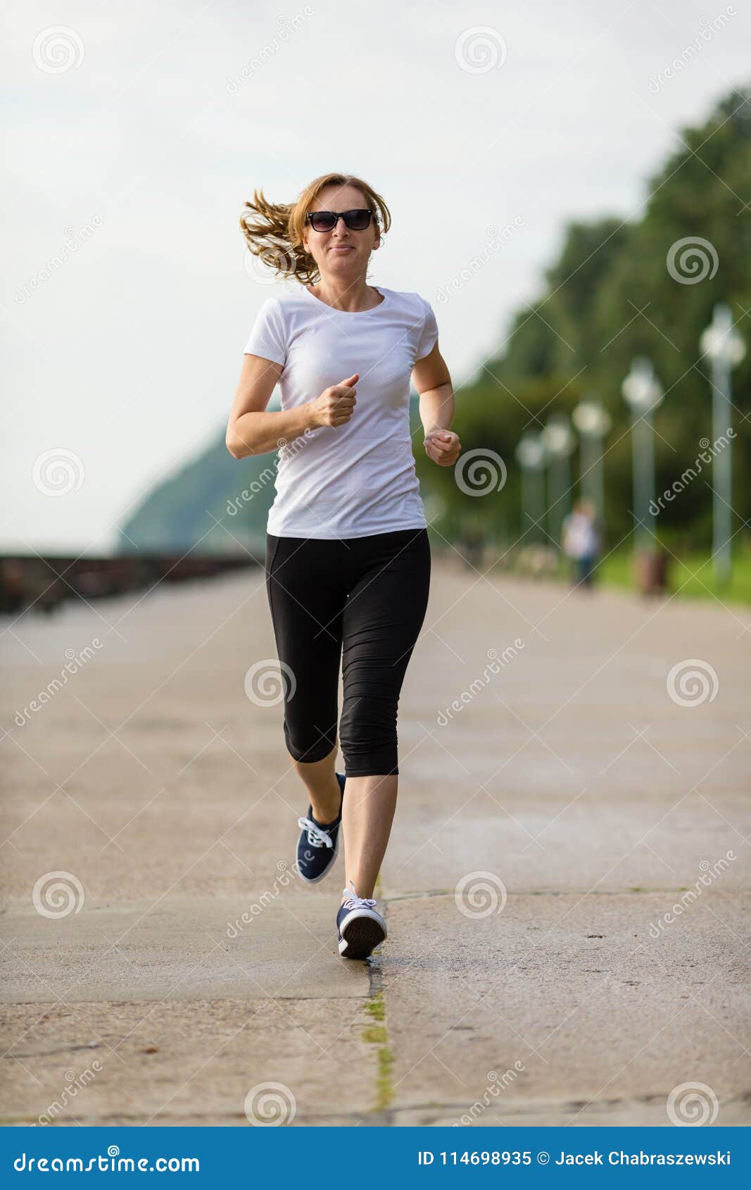 Middle-aged woman running stock image. Image of caucasian - 114698935