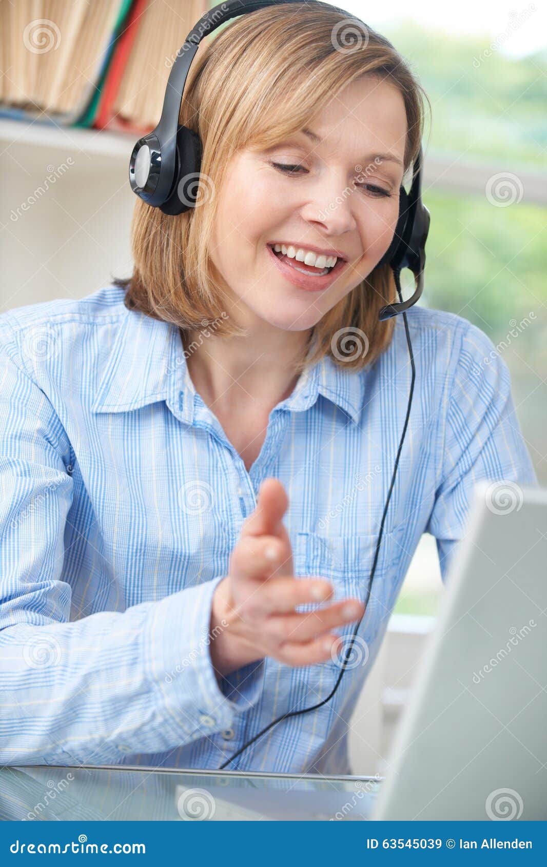 Middle Aged Woman Talking Online Using Headset Stock Image - Image of ...