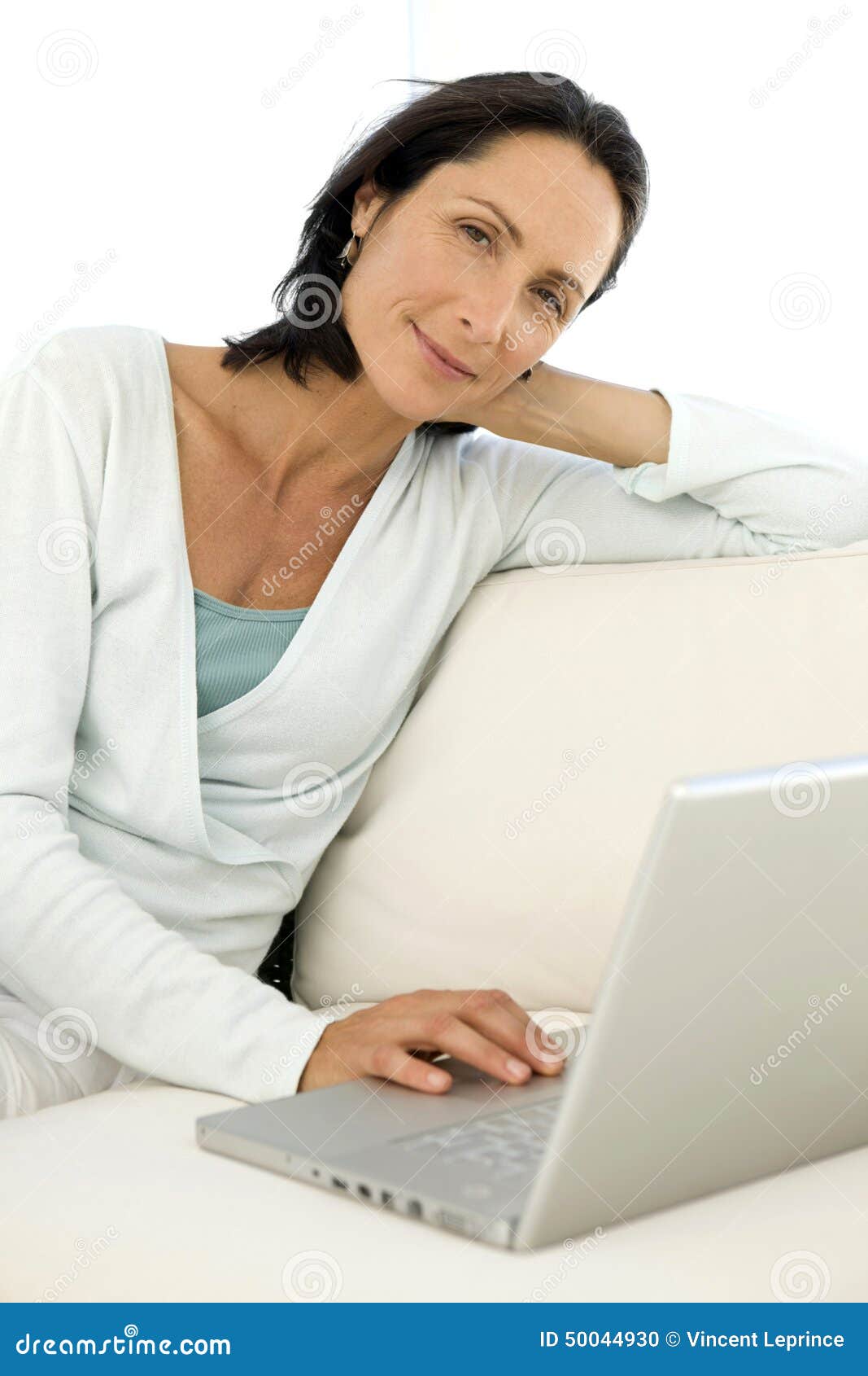 Middle-aged Woman Using Laptop Stock Photo - Image of downloading ...