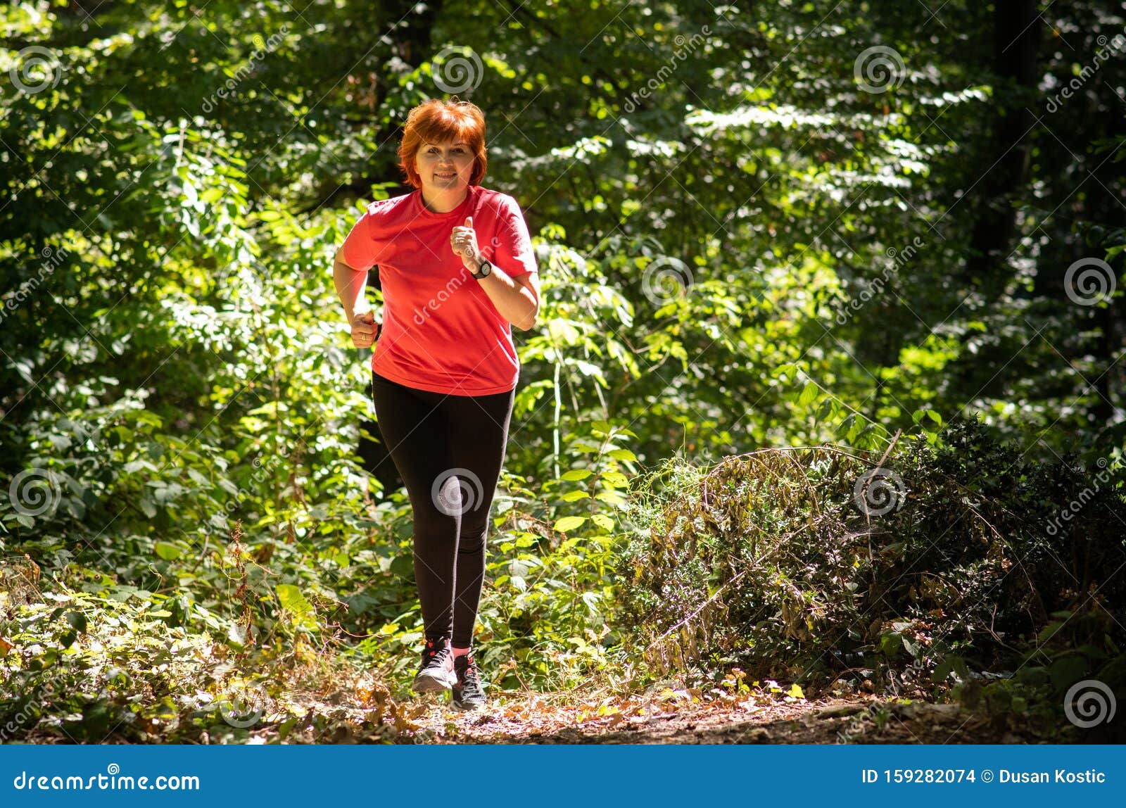 Middle aged women running stock photo. Image of summer - 159282074