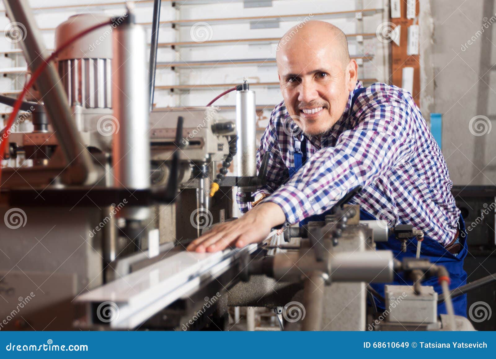 Middle Aged Worker Working on a Machine in PVC Shop Stock Image - Image ...