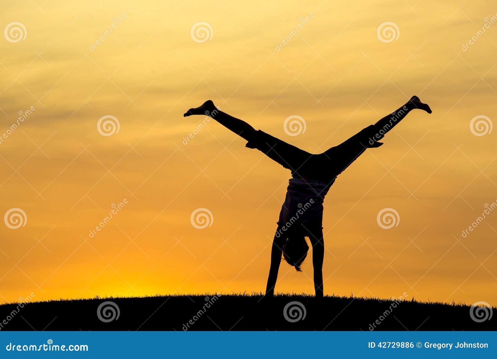 Middle of a Cartwheel at Sunset. Stock Photo - Image of athletic ...