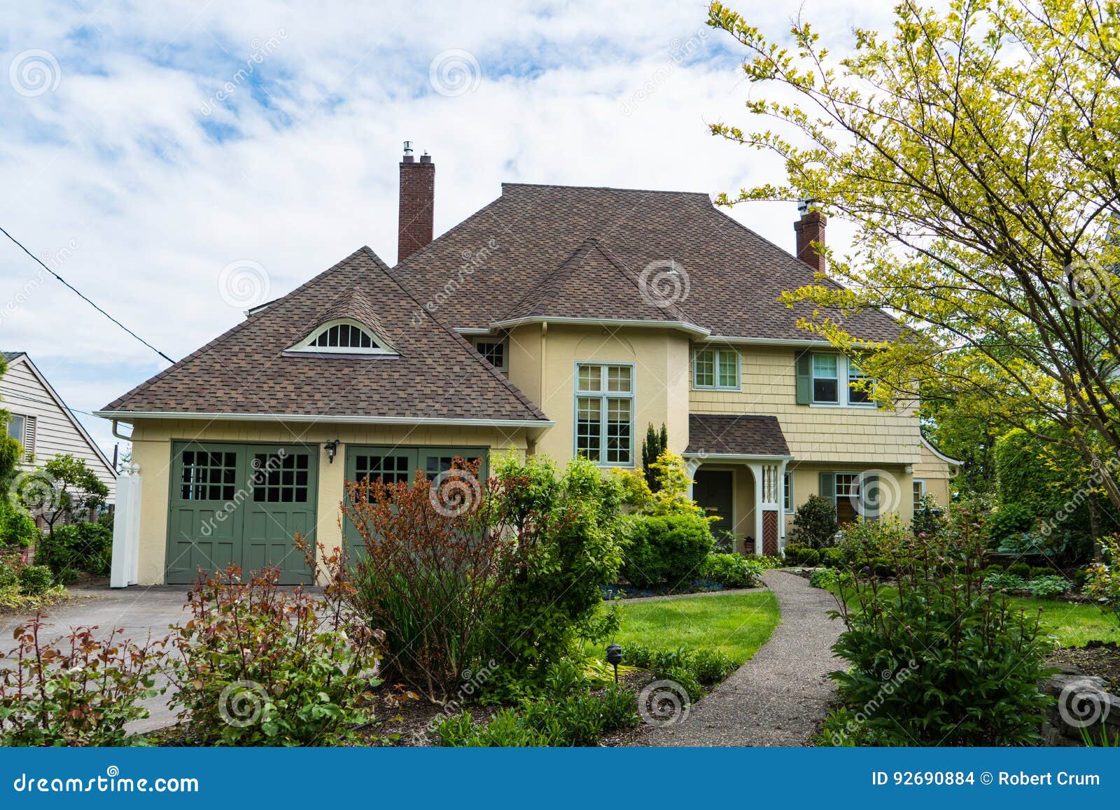 Middle-class Yellow House with Landscaping in Front Yard Stock Photo ...