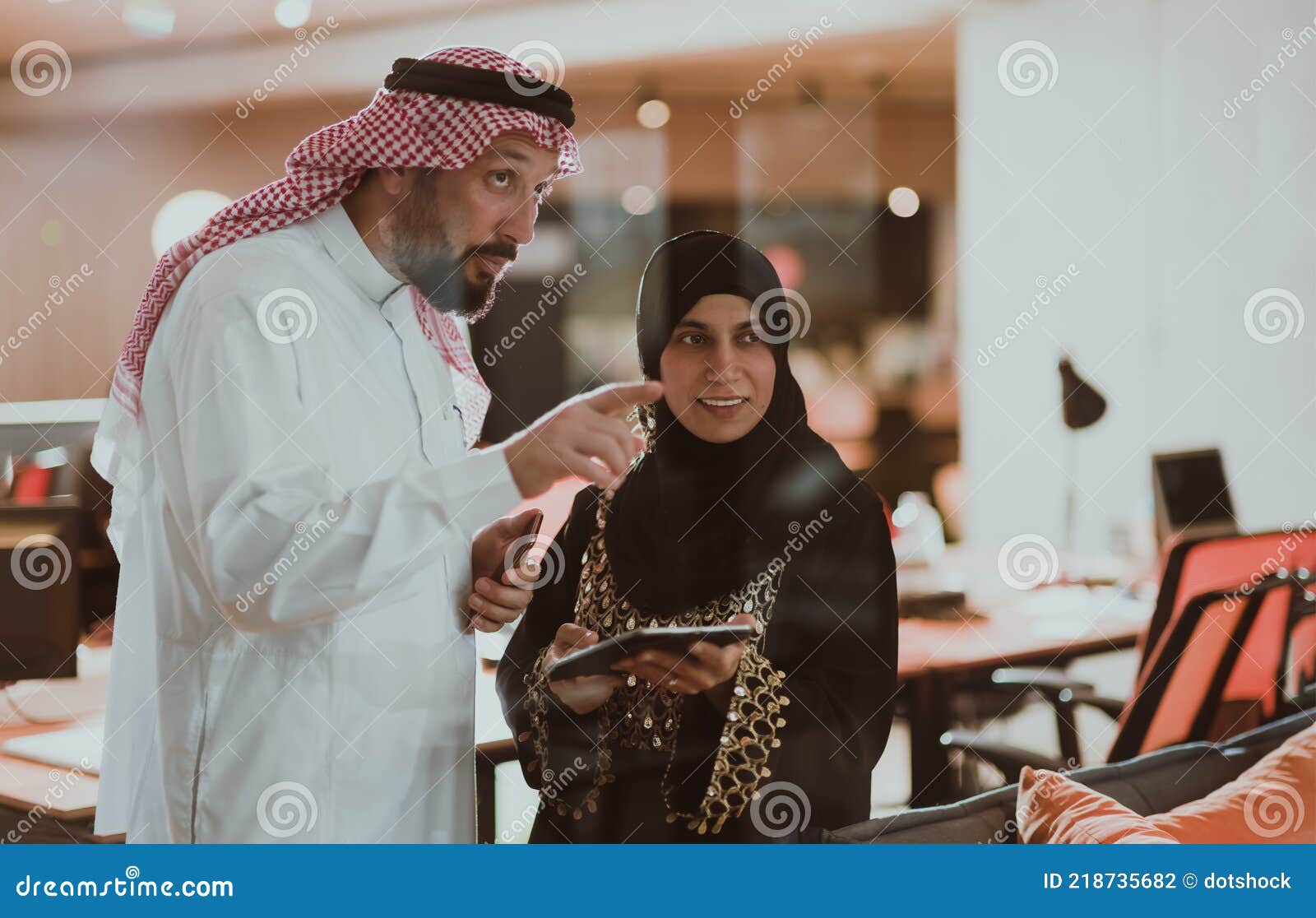 Middle Eastern Business Team in the Office Working on a Tablet Computer ...