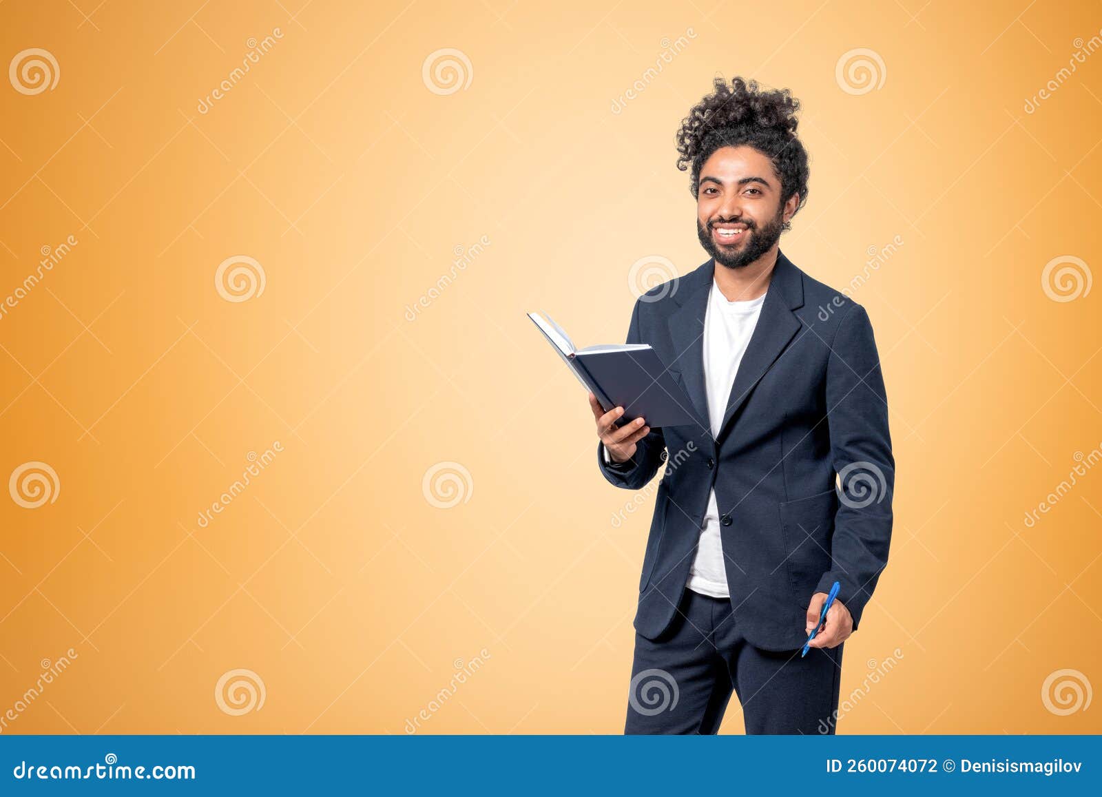 Middle Eastern Businessman with Notebook and Pen Smiling, Copy S Stock ...