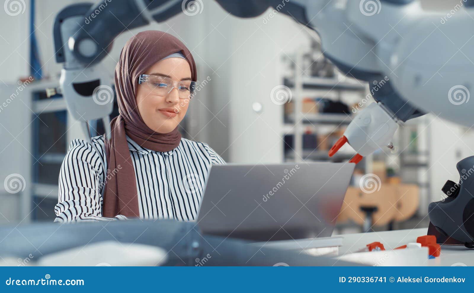 Middle Eastern Engineer in Hijab Conducts an in-depth Analysis of the ...