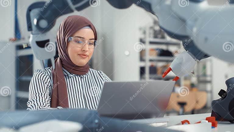 Middle Eastern Engineer in Hijab Conducts an in-depth Analysis of the ...