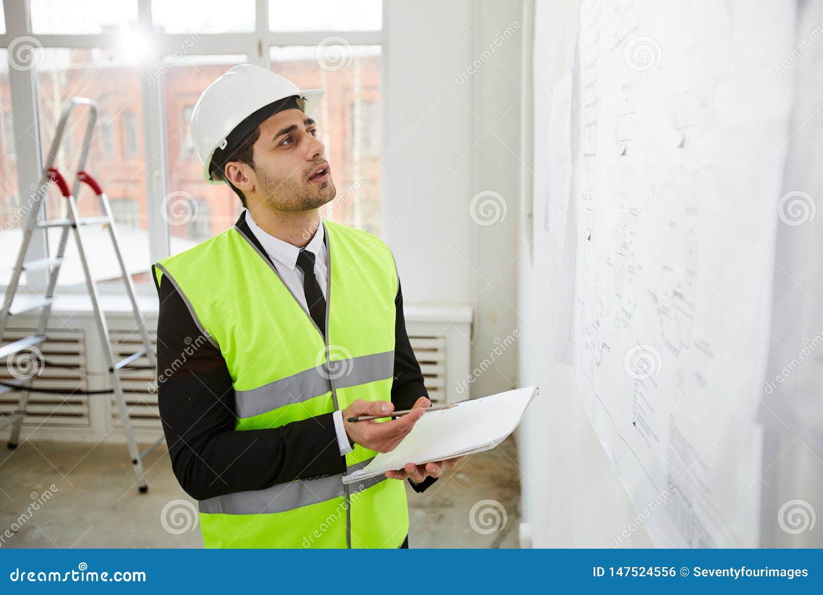 Middle-Eastern Engineer Inspecting Site Stock Photo - Image of holding ...