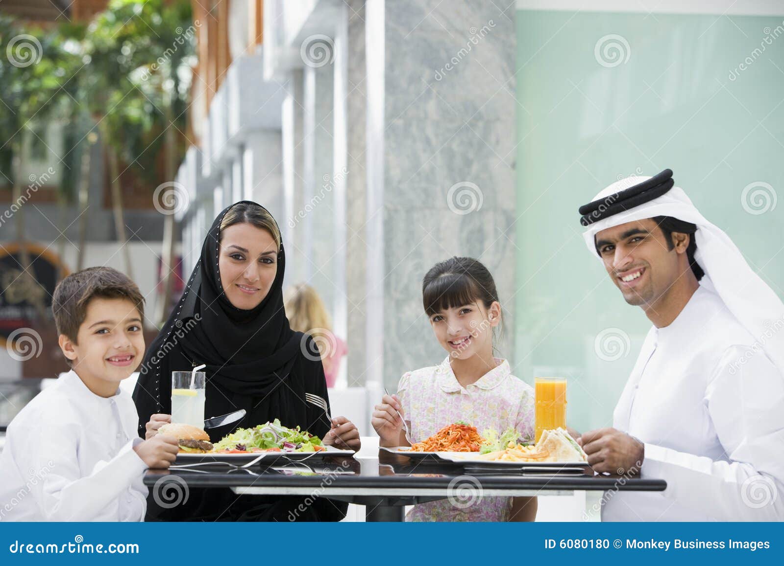 A Middle Eastern Family Enjoying a Meal Stock Photo - Image of arabic ...