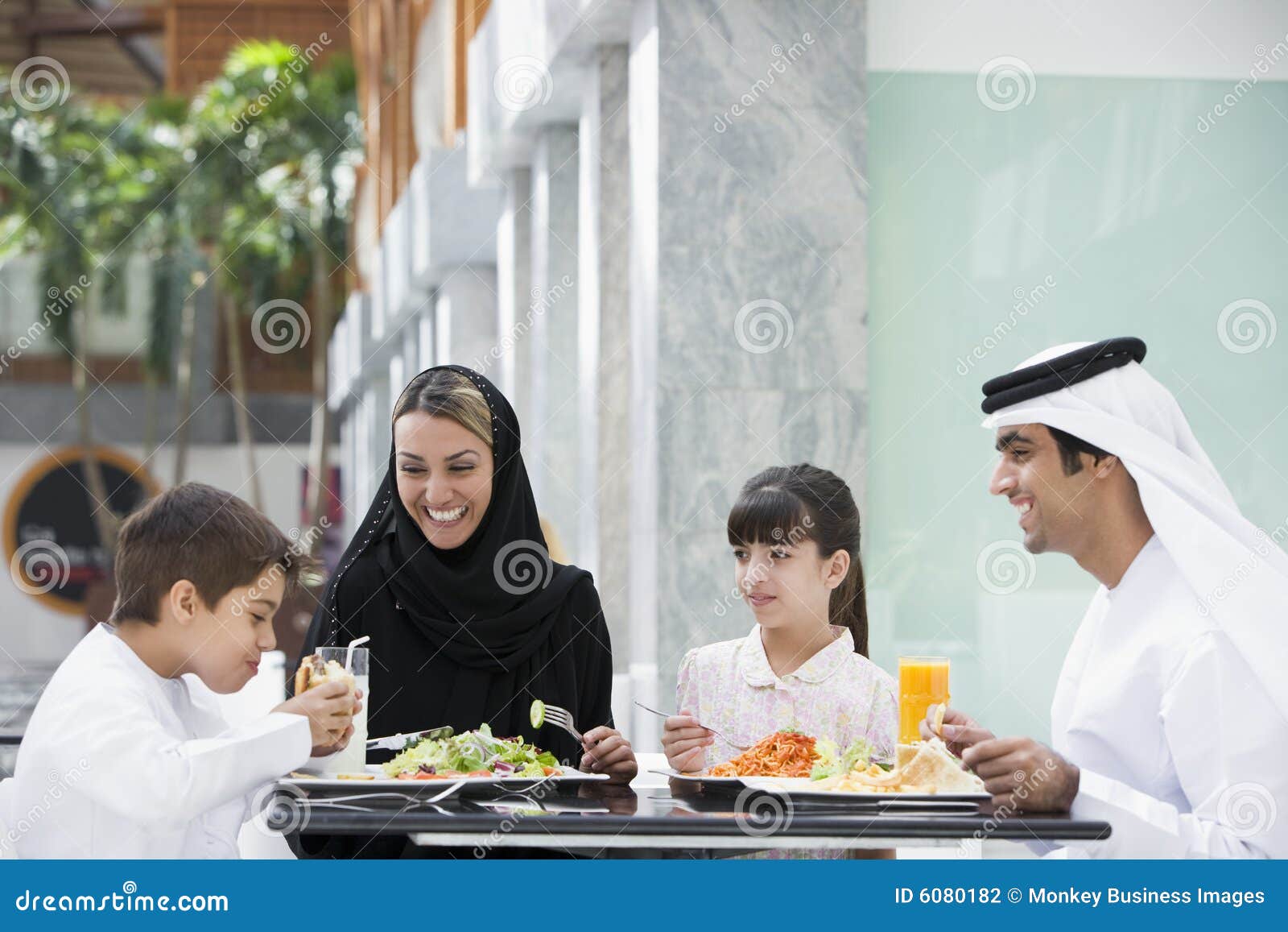 A Middle Eastern Family Enjoying a Meal Stock Photo - Image of inside ...
