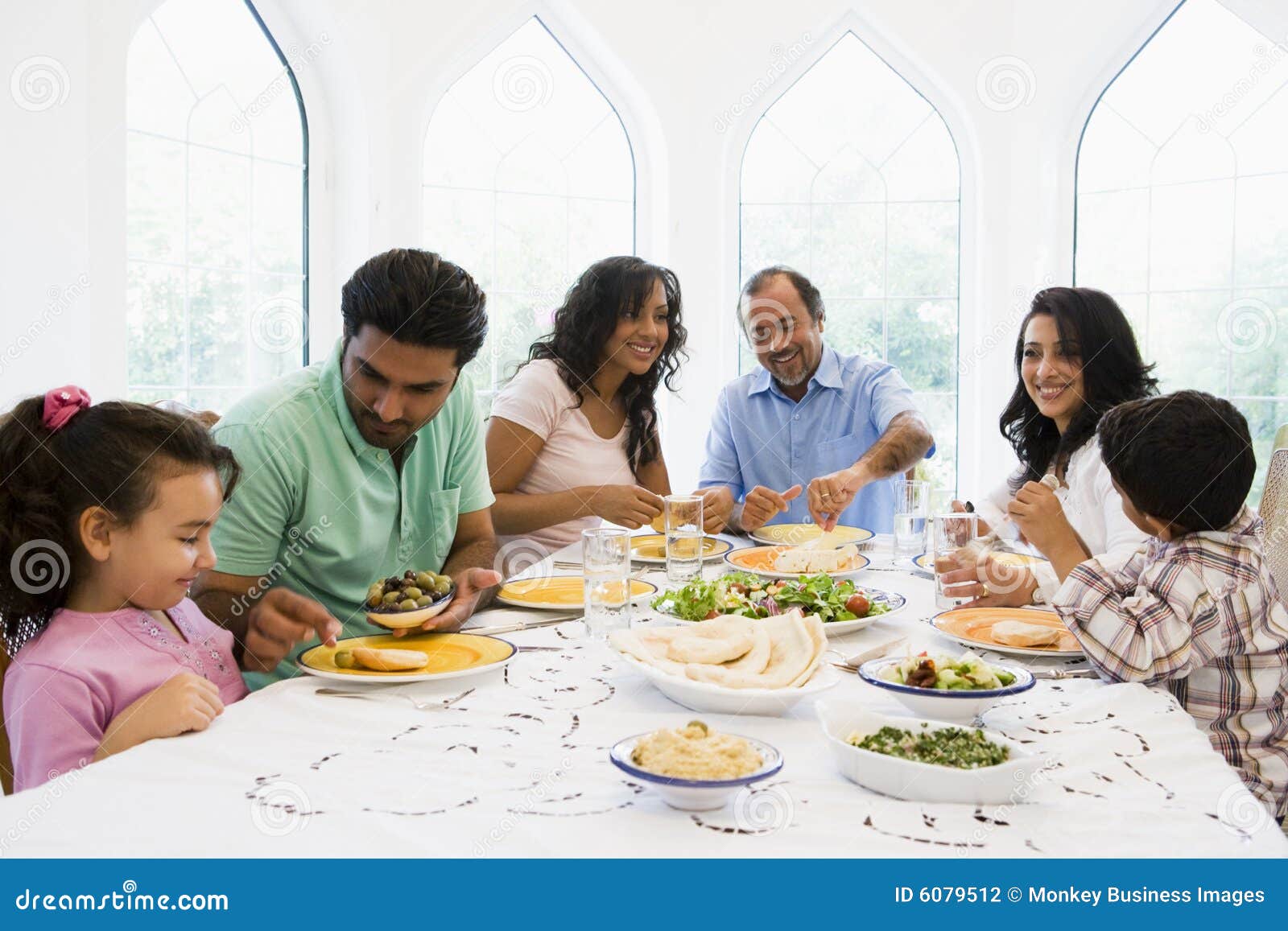 A Middle Eastern Family Enjoying a Meal Together Stock Photo - Image of ...