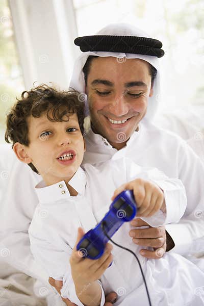 A Middle Eastern Father and Son Playing Stock Photo - Image of clothing ...