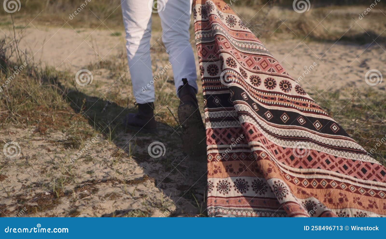 Middle-Eastern Male Dragging a Blanket through a Field Stock Video ...
