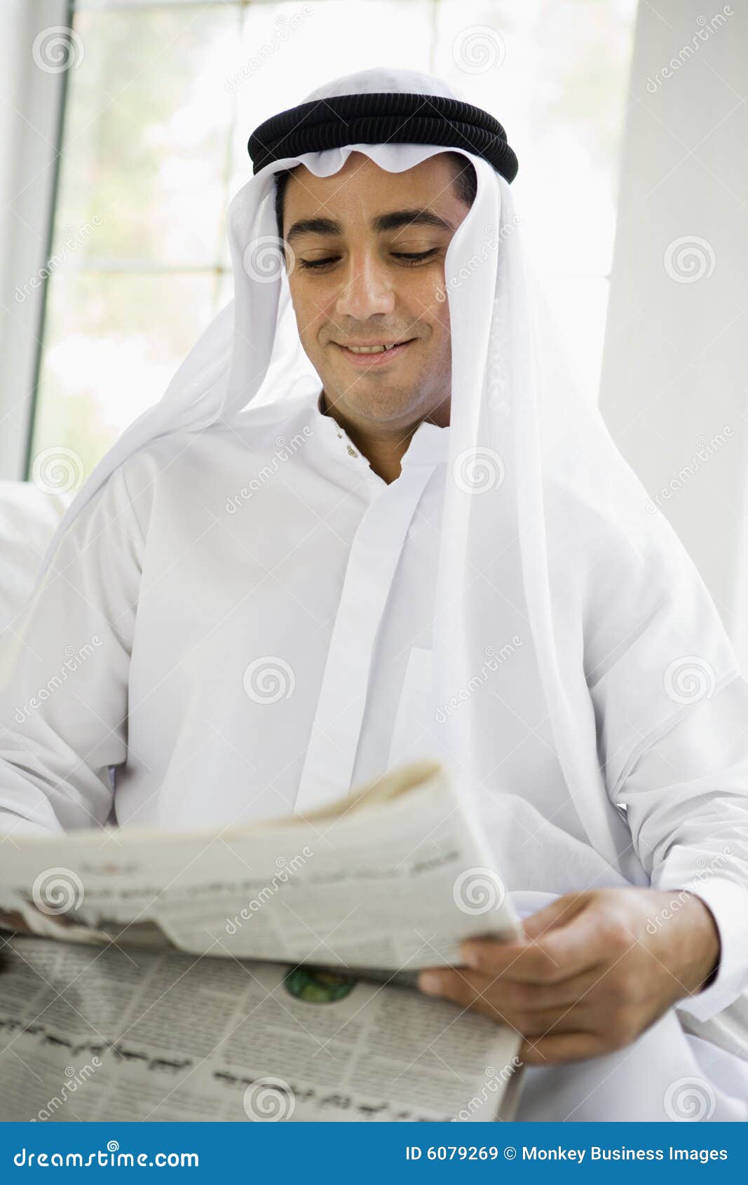A Middle Eastern Man Reading a Newspaper Stock Image - Image of ...