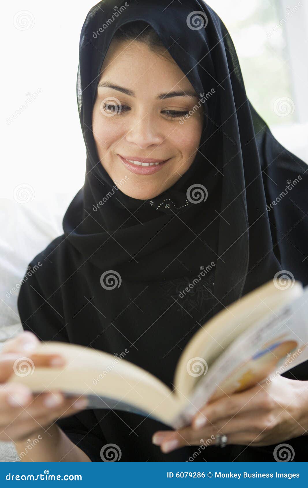 A Middle Eastern Woman Reading a Book Stock Photo - Image of smiling ...