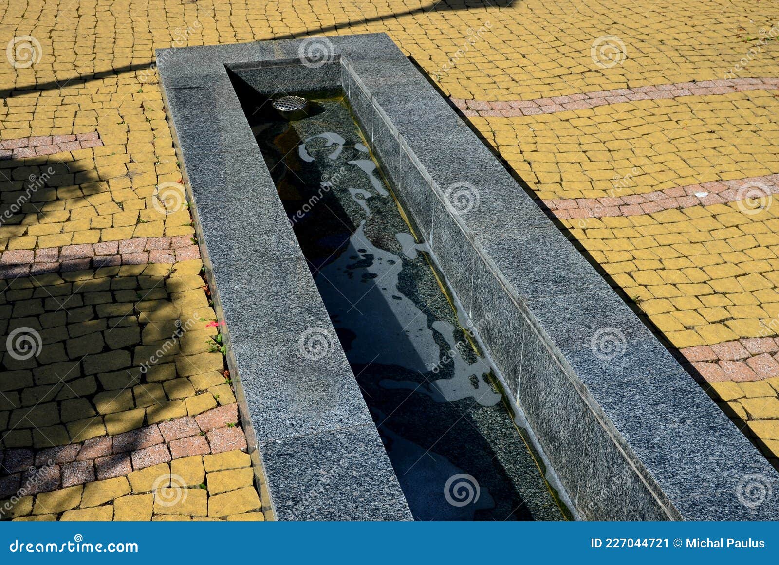 In the Middle of the Promenade There is an Artificial Stream in a ...