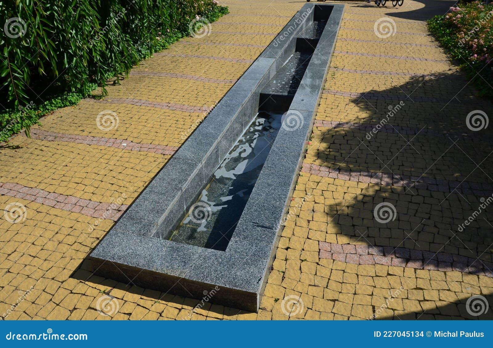 In the Middle of the Promenade There is an Artificial Stream in a ...