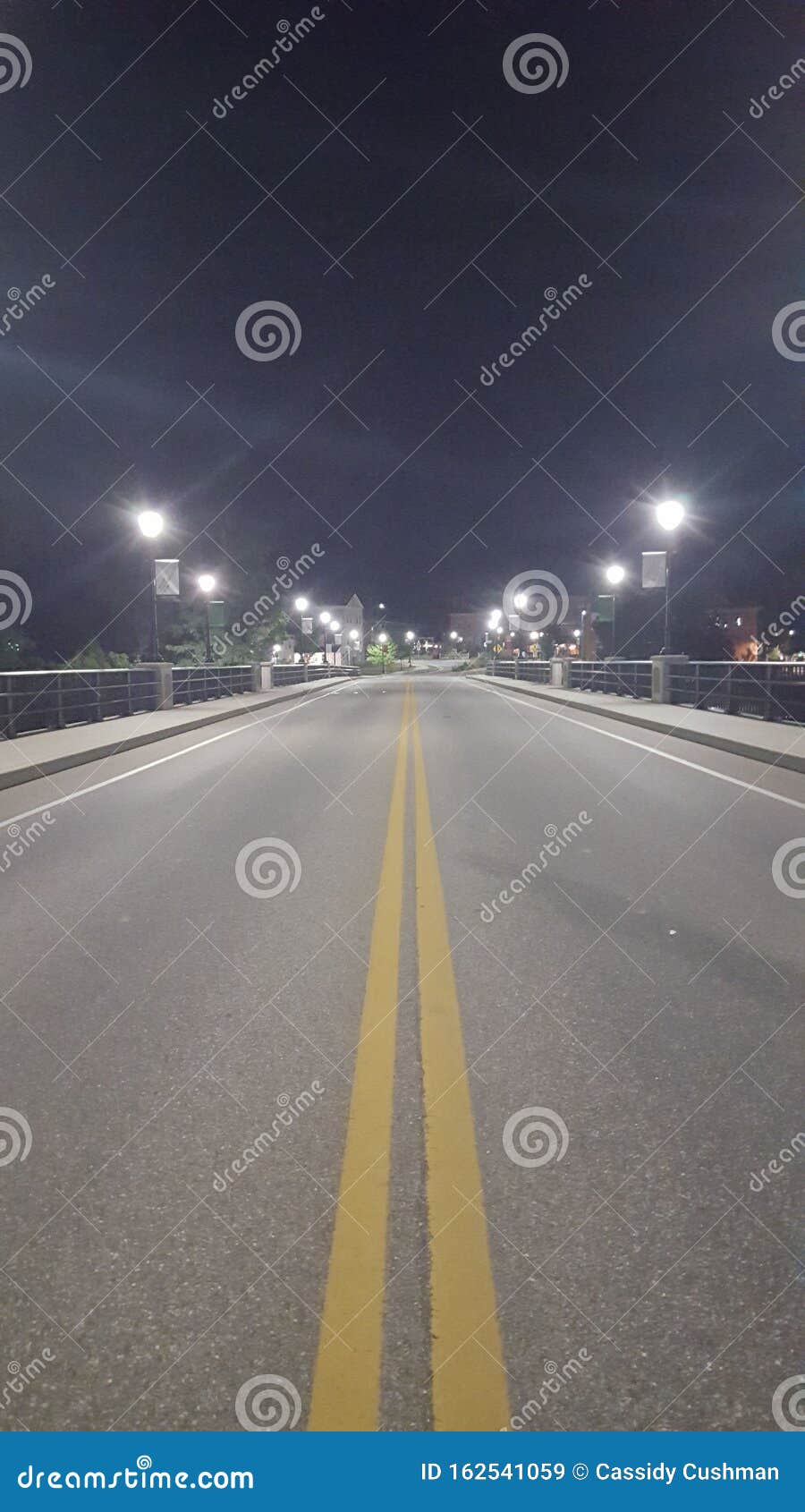 Middle of Road at Night with Bright Lights Stock Image - Image of ...