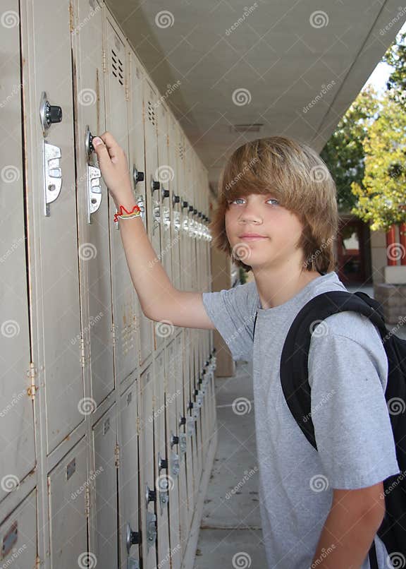 Middle schooler at locker stock image. Image of education - 16660371
