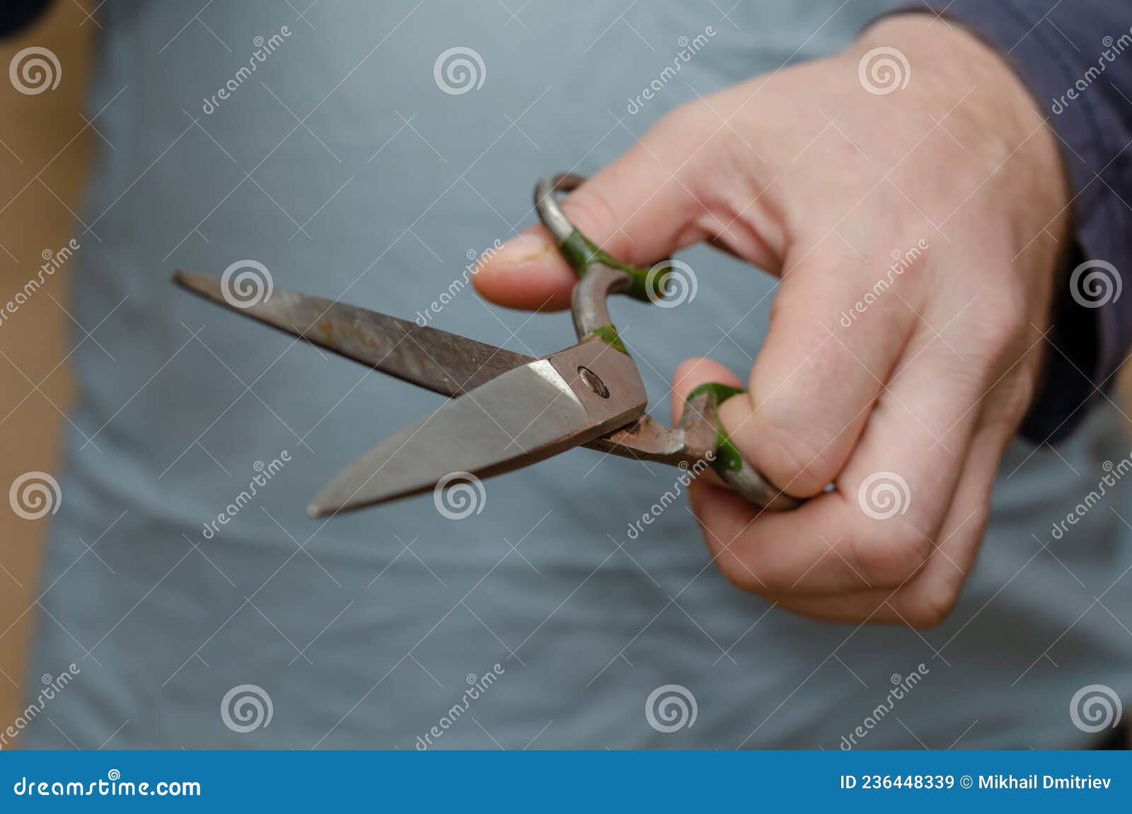 The Middle Section of the Man Holding the Old Open Scissors Stock Image ...
