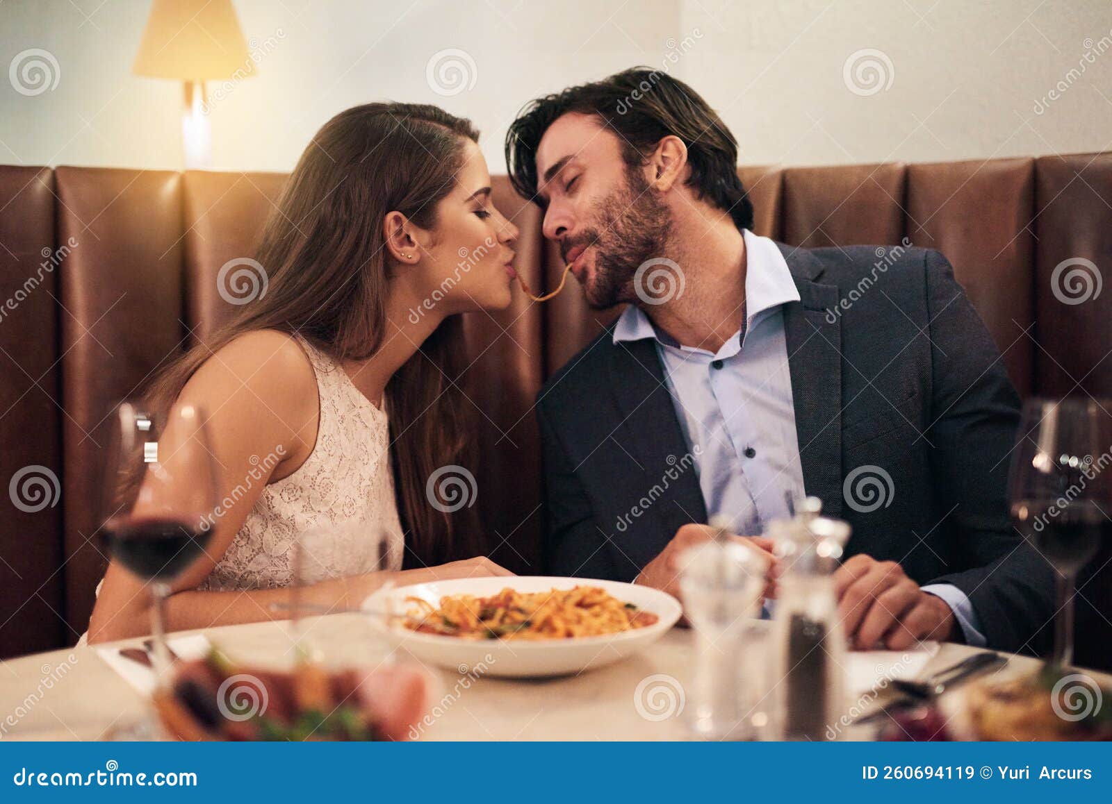The Middle is Where it Gets Delicious. a Young Couple Sharing Spaghetti ...