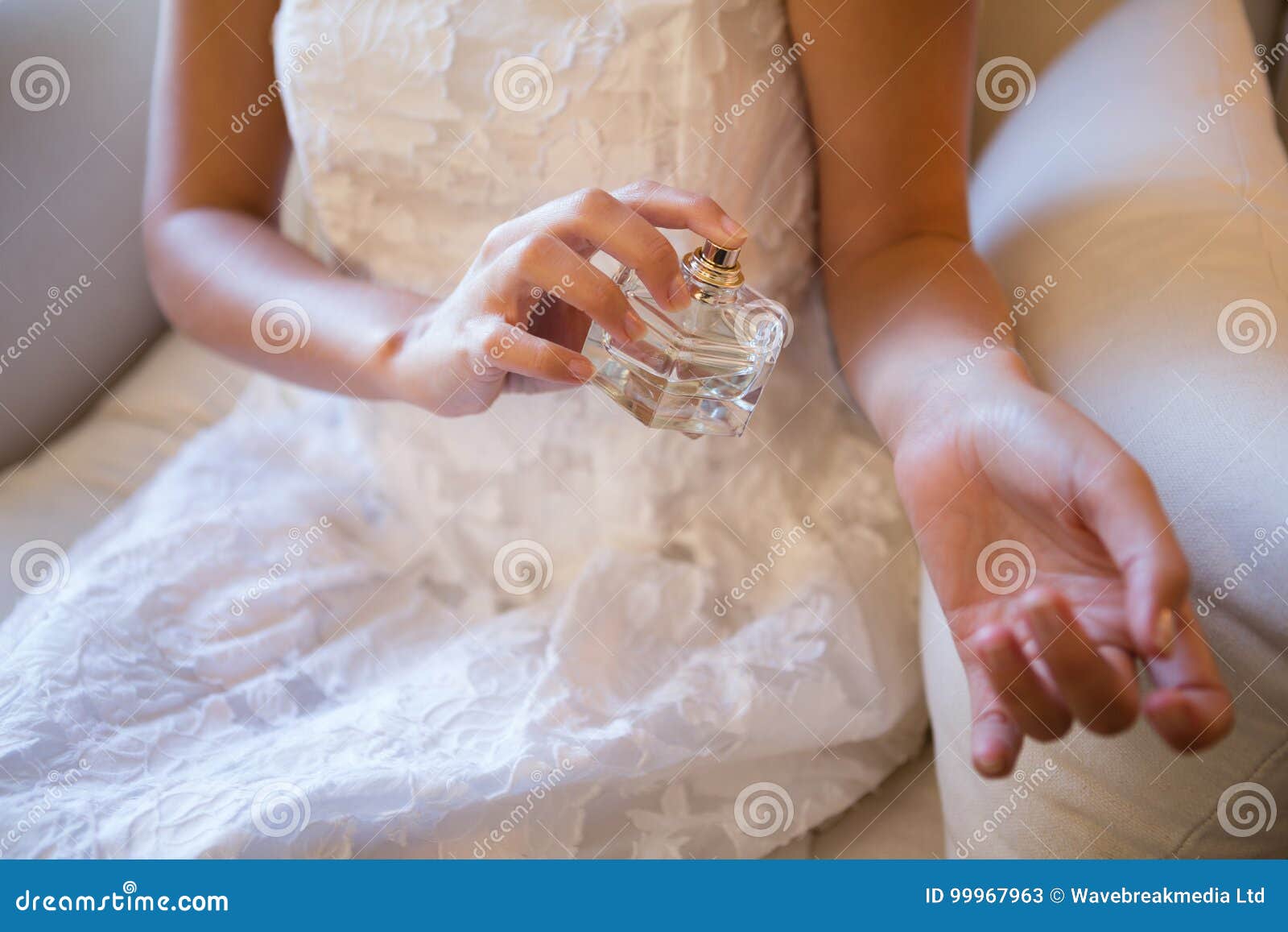 Midsection of Bride Spraying Perfume on Hand Stock Image - Image of ...