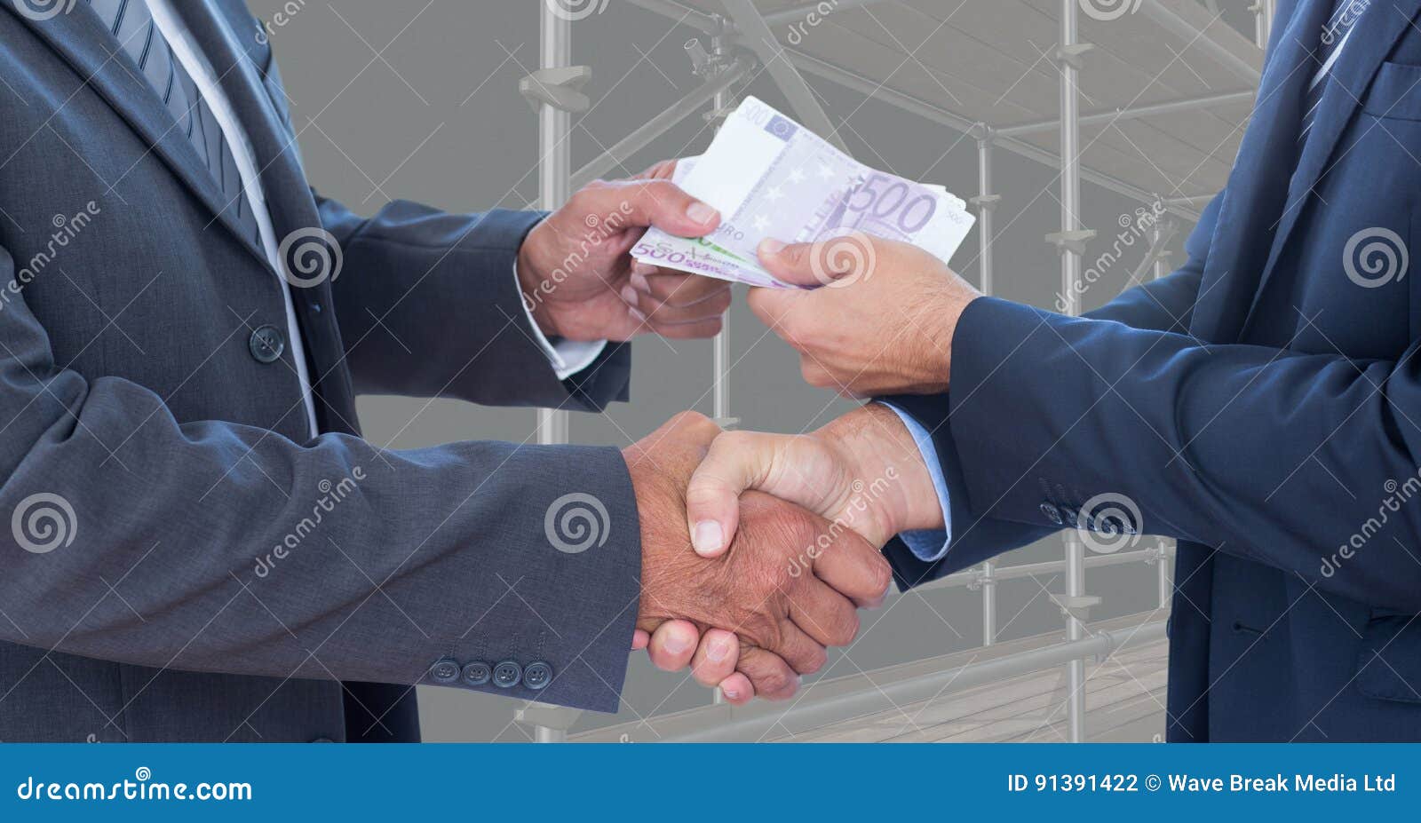 Midsection of Business People Shaking Hands while Passing Money Stock ...