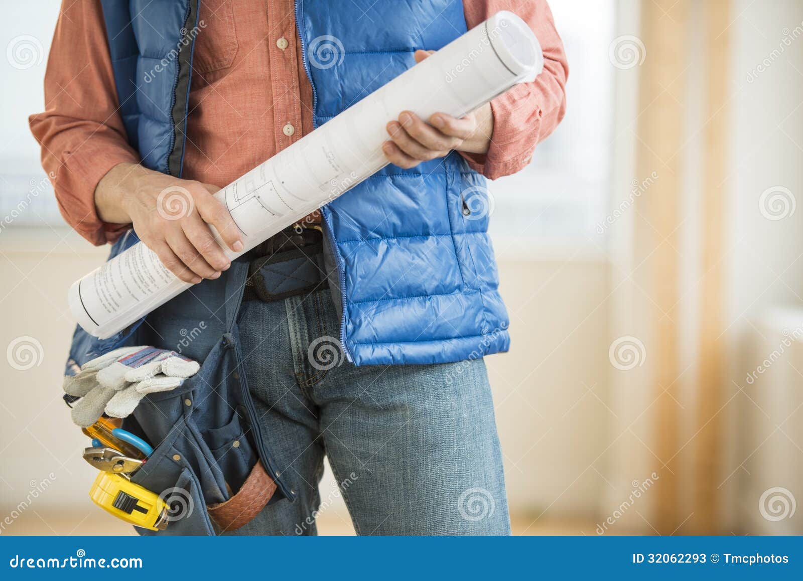 Midsection of Construction Worker Holding Blueprint Stock Image - Image ...