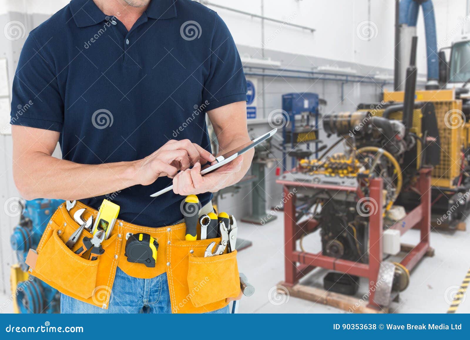 Midsection of Handyman Using Tablet PC at Workshop Stock Photo - Image ...