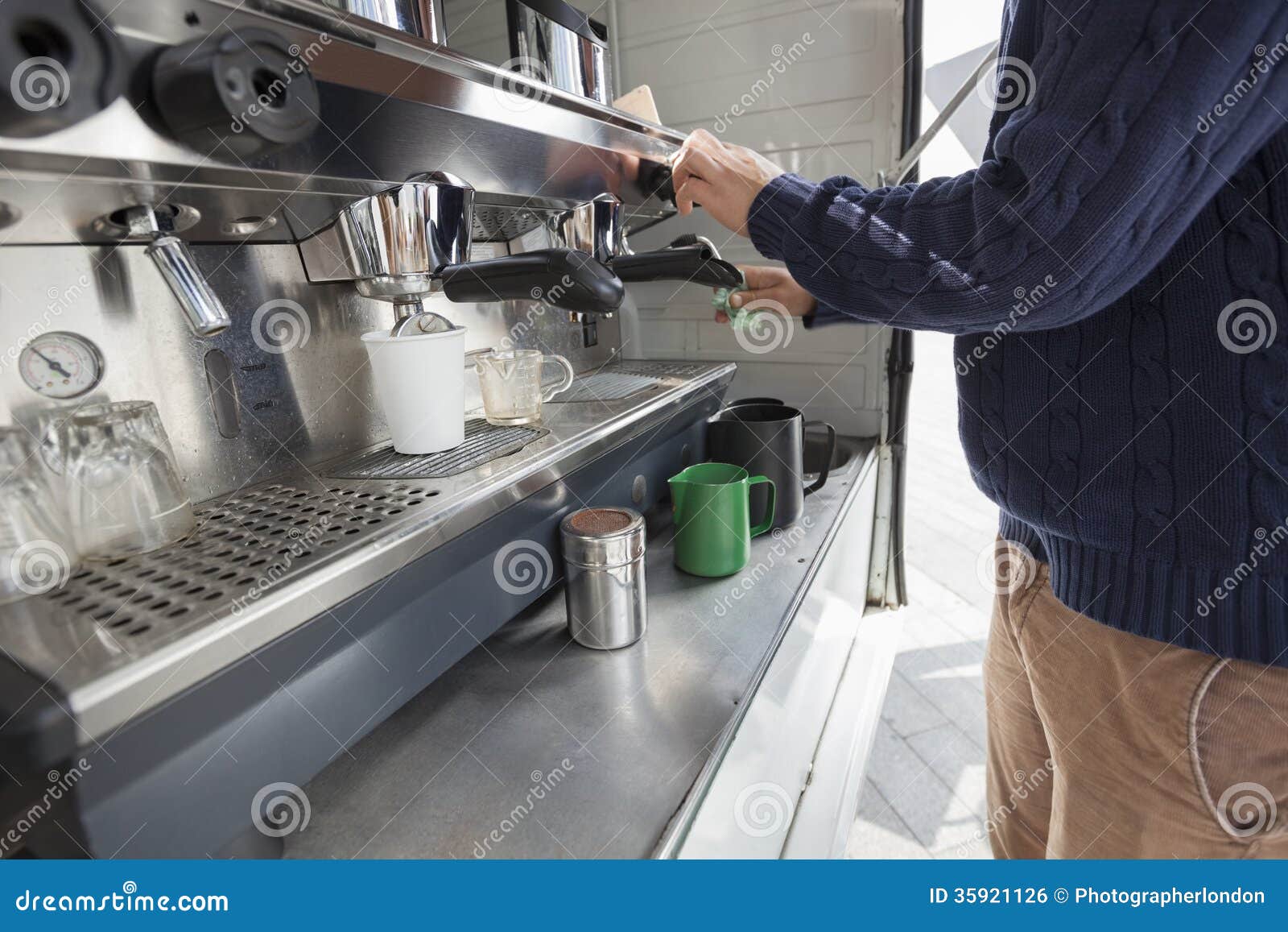 Midsection of Man Cleaning Coffee Machine at Mobile Shop Stock Photo ...