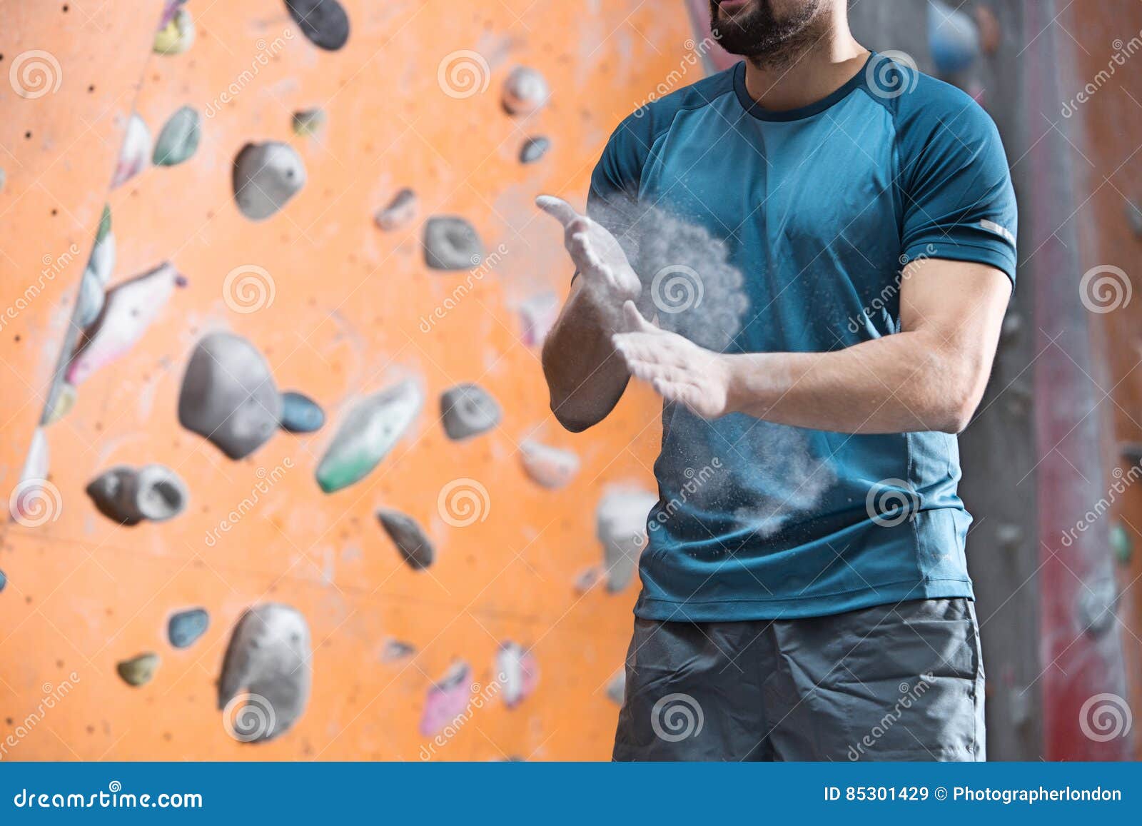 Midsection of Man Dusting Powder by Climbing Wall in Crossfit Gym Stock ...