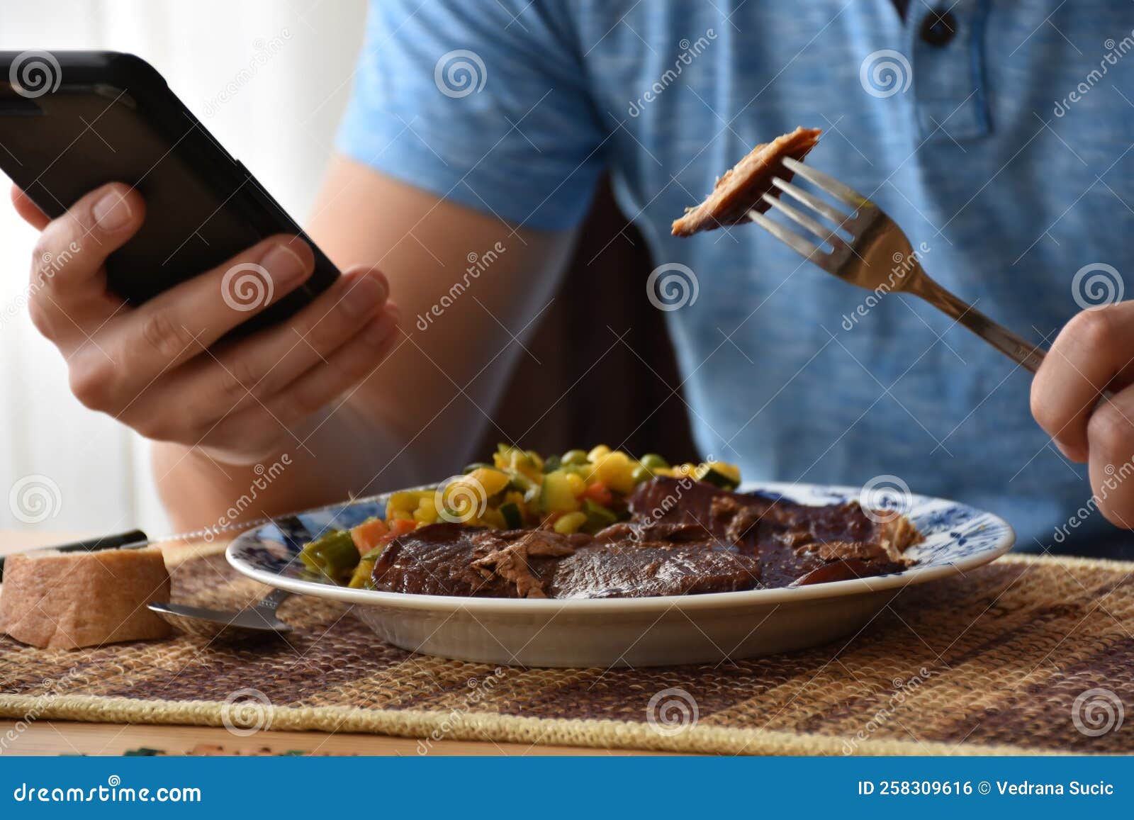 Man Eating Lunch and Using Mobile Phone Stock Photo - Image of cooking ...
