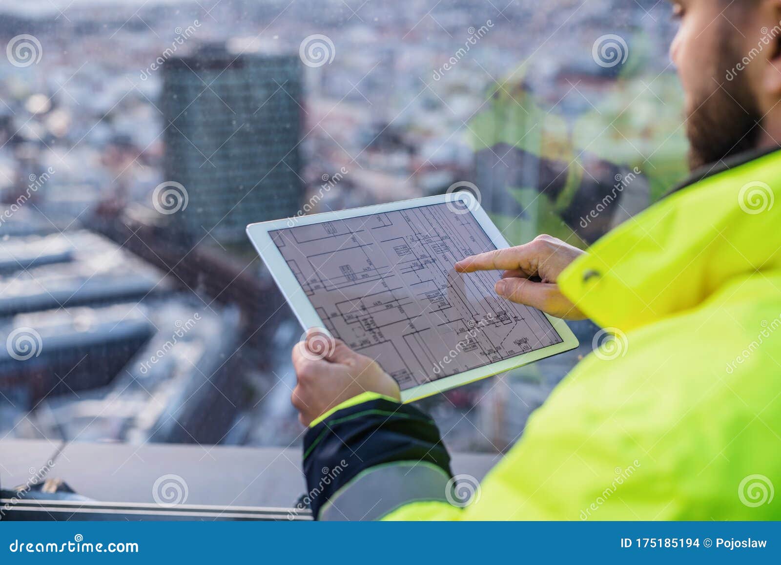 Midsection of Man Engineer with Tablet on Construction Site, Looking at ...