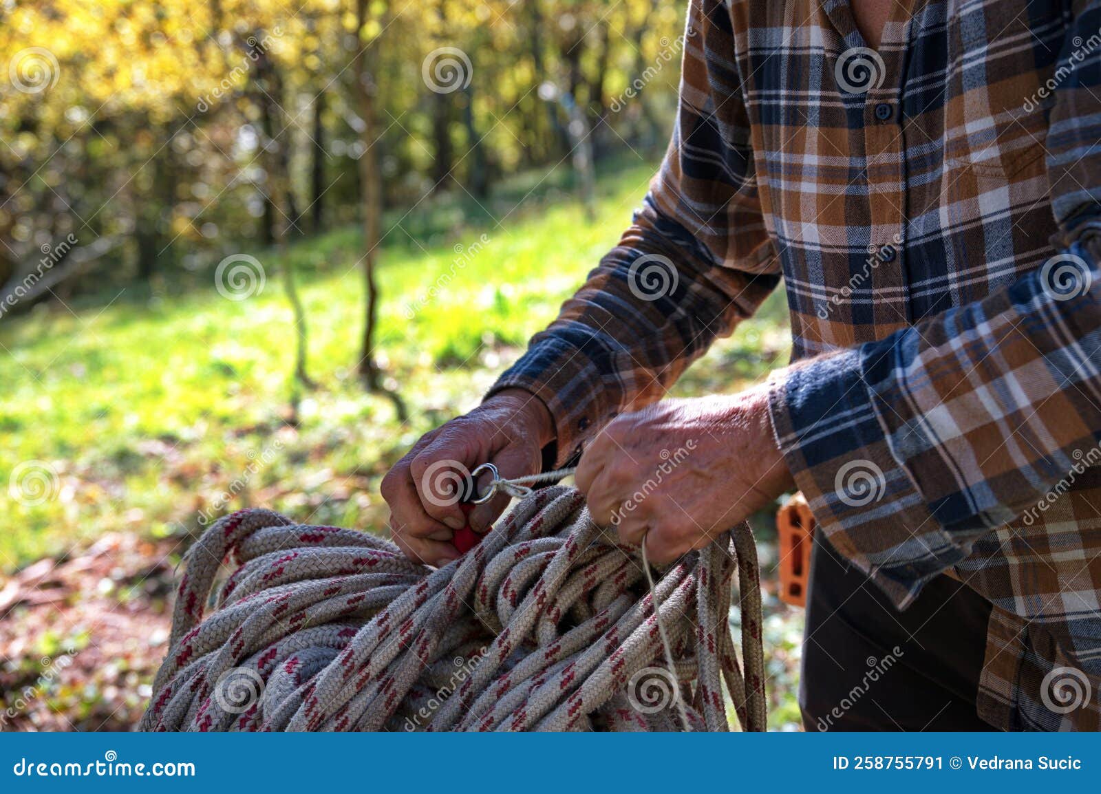 Midsection of Man Preparing Rope Stock Image - Image of green, person ...